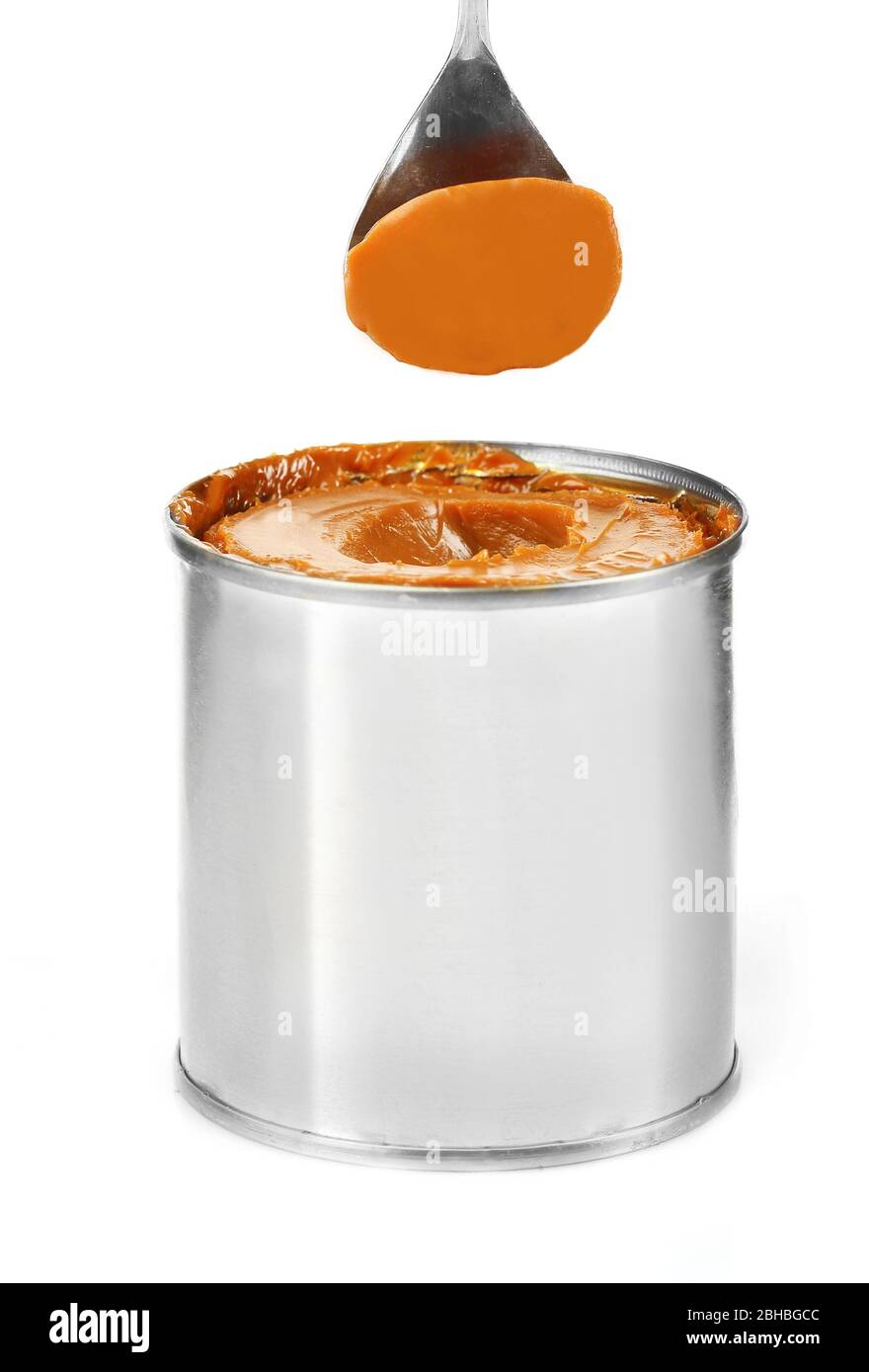 Can of boiled condensed milk with spoon isolated on white Stock Photo ...