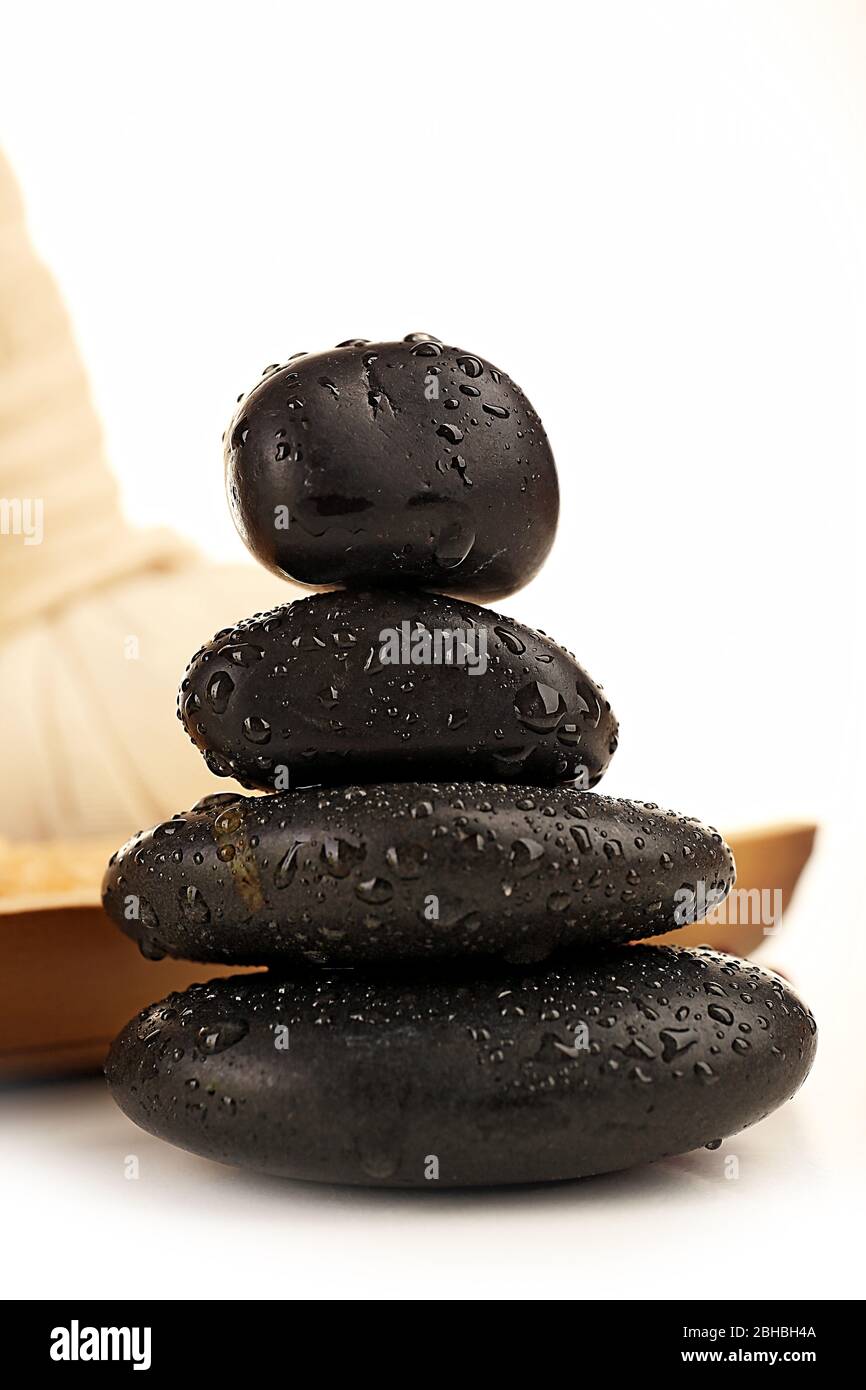 Spa stones isolated on white Stock Photo - Alamy