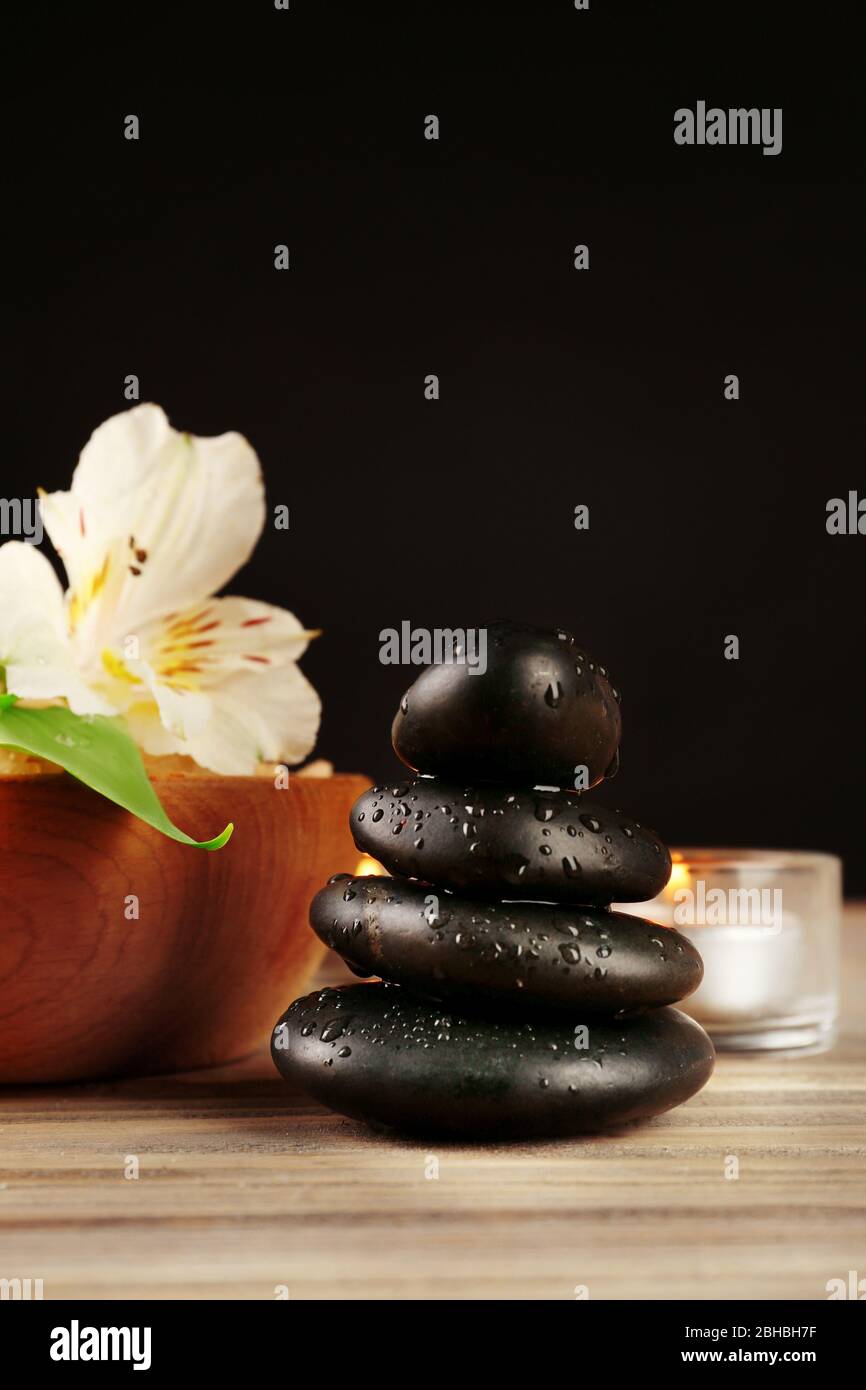 Spa still life on wooden table on black background Stock Photo - Alamy