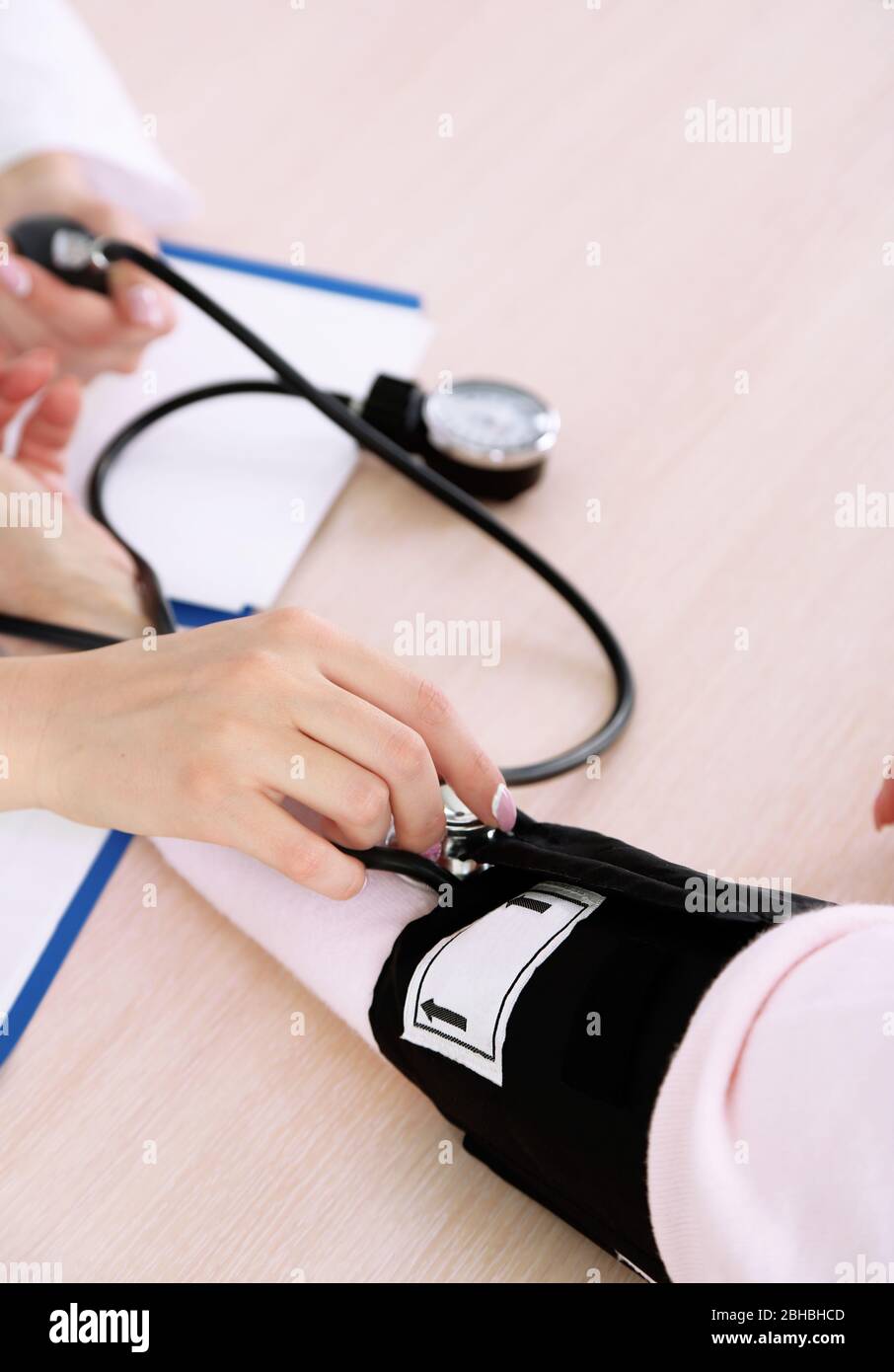 Blood pressure measuring. Doctor and patient in hospital Stock Photo ...