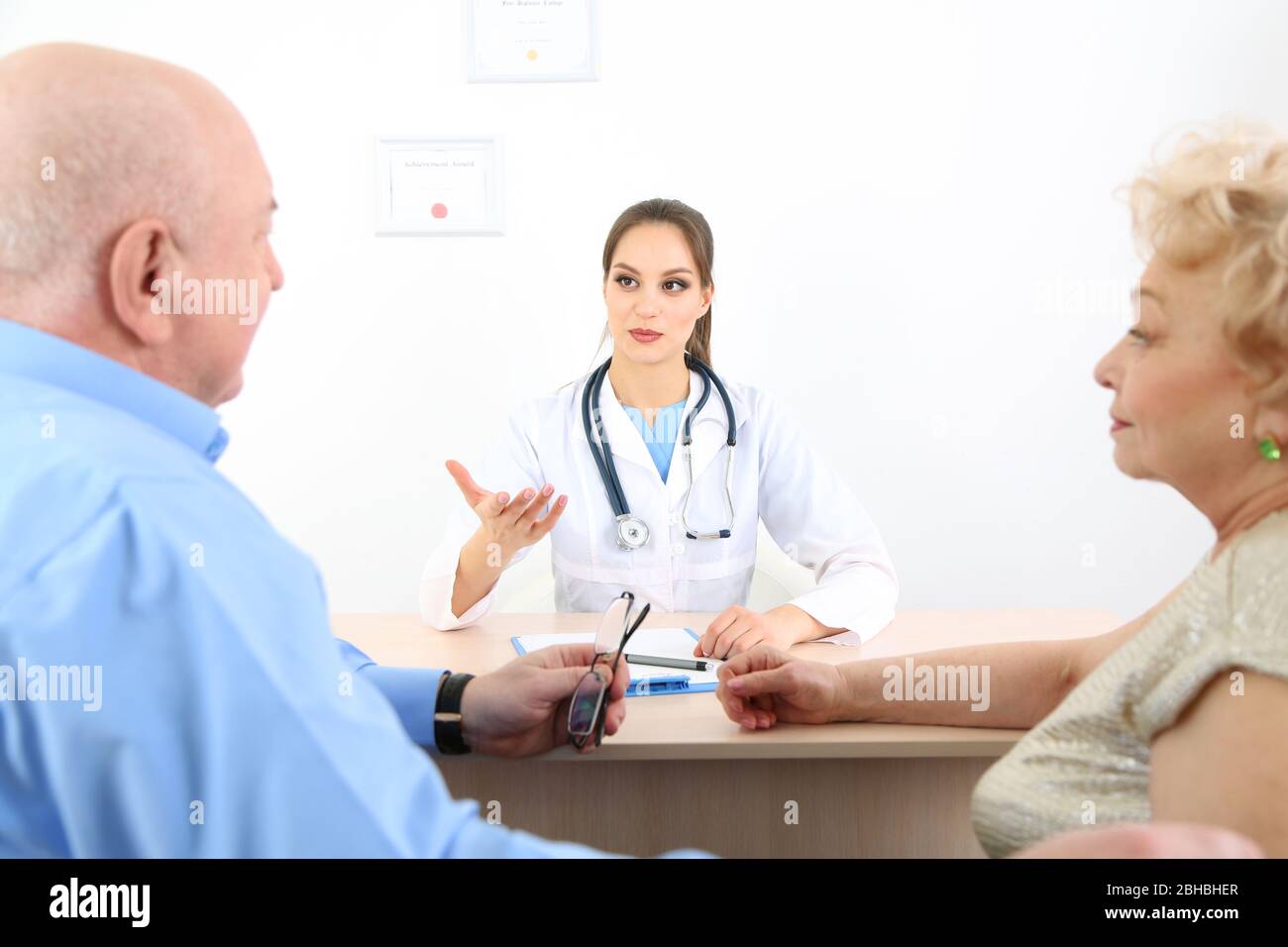 Happy doctor and patients in hospital clinic Stock Photo - Alamy