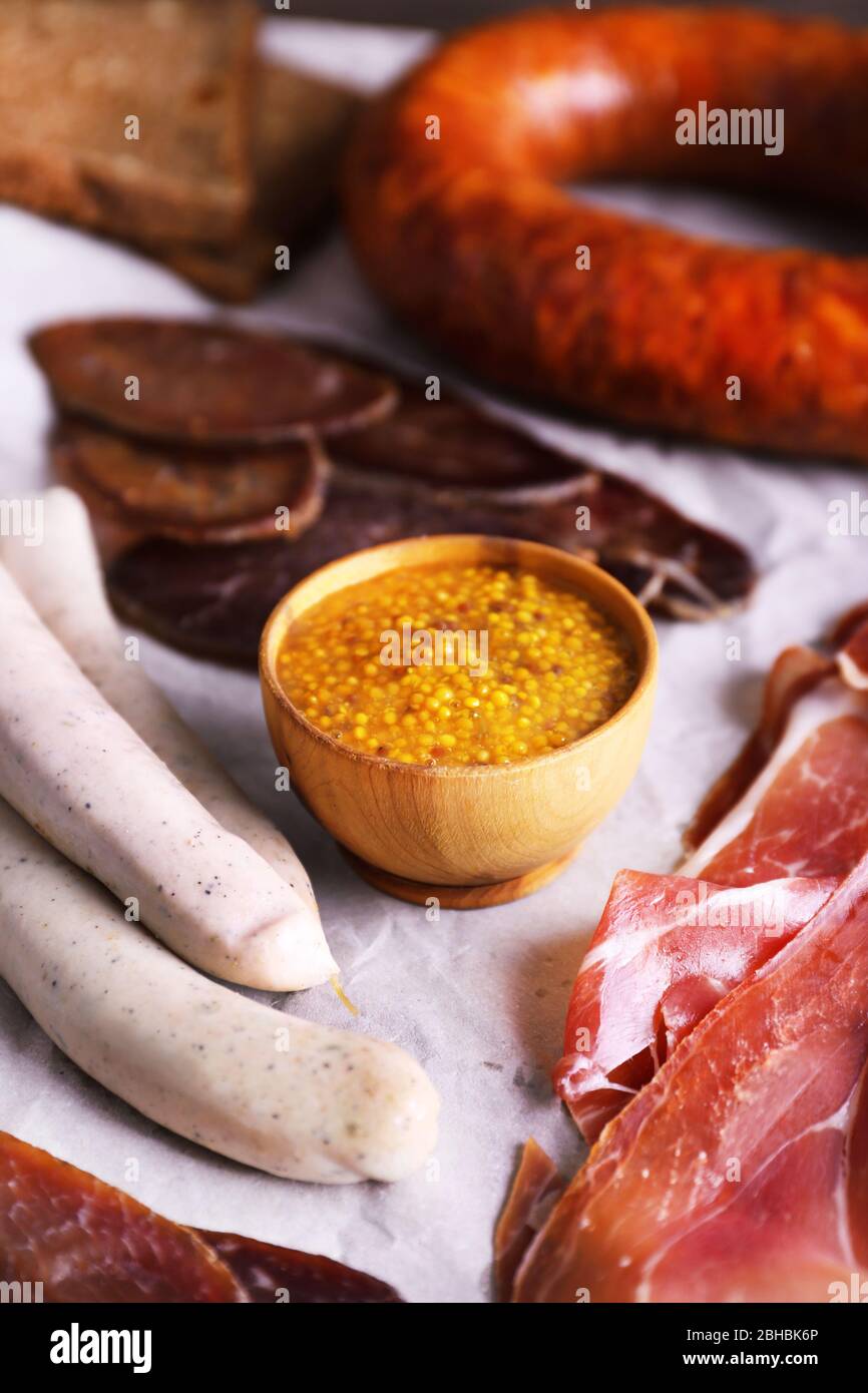Assortment of deli meats on parchment background Stock Photo - Alamy