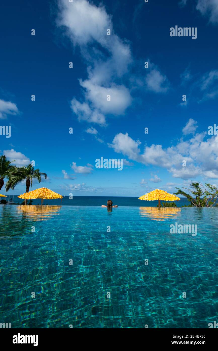 The Caribbean, Anguilla. Woman in the pool at Malliouhana Hotel Stock ...