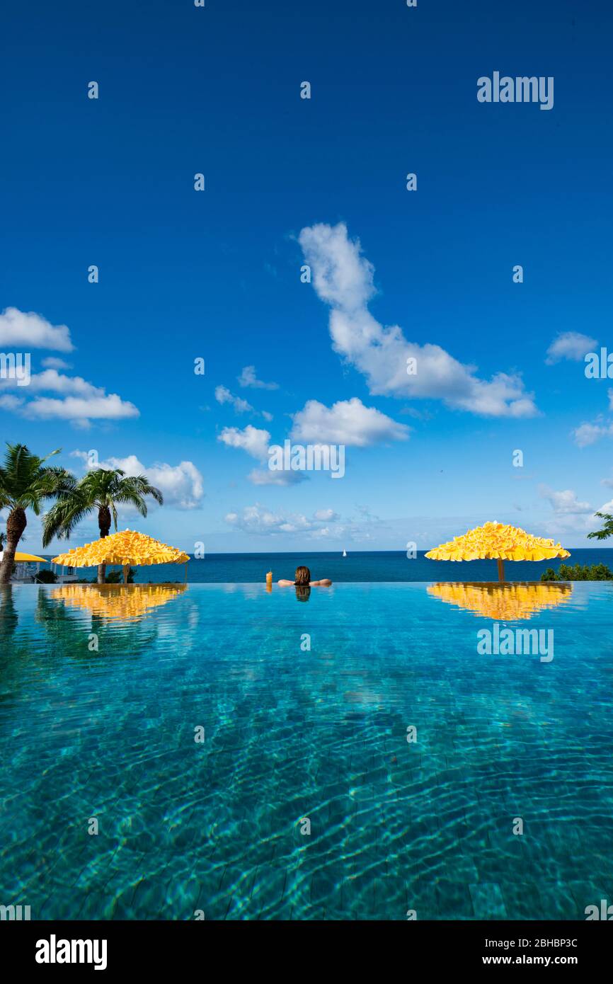 The Caribbean, Anguilla. Woman in the pool at Malliouhana Hotel Stock ...