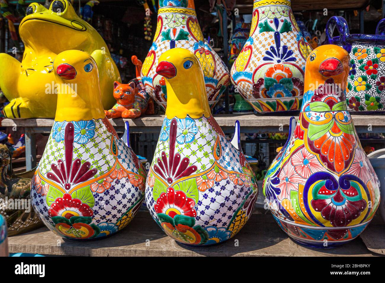 Three colorful ceramic hens in a Tequisquiapan, Mexico market Stock ...