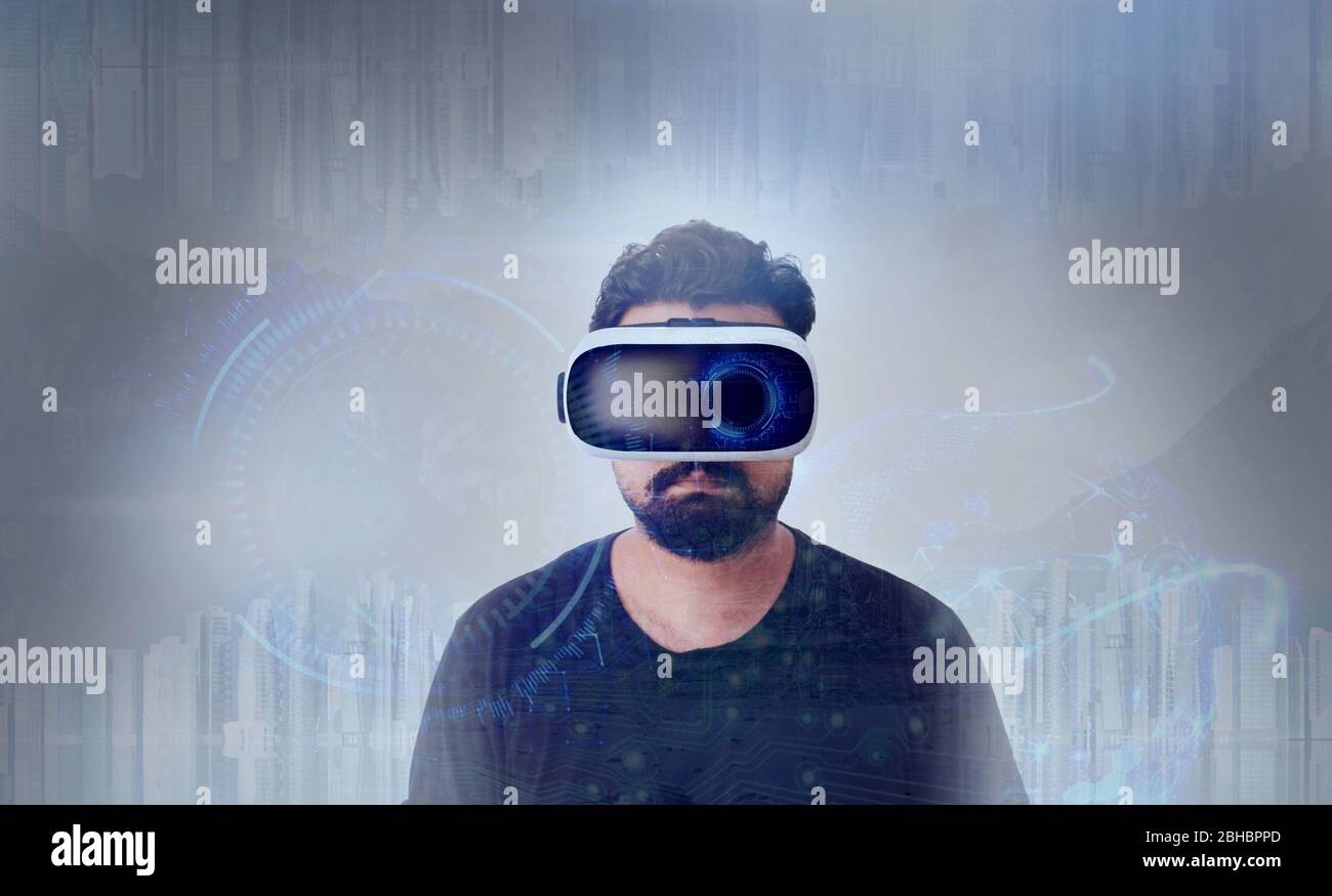 Young Guy in black t shirt looking through VR (Virtual Reality) glasses ...