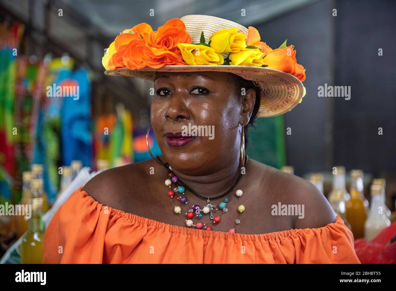 Caribbean, Lesser Antilles, Martinique. Local market, woman in hat ...