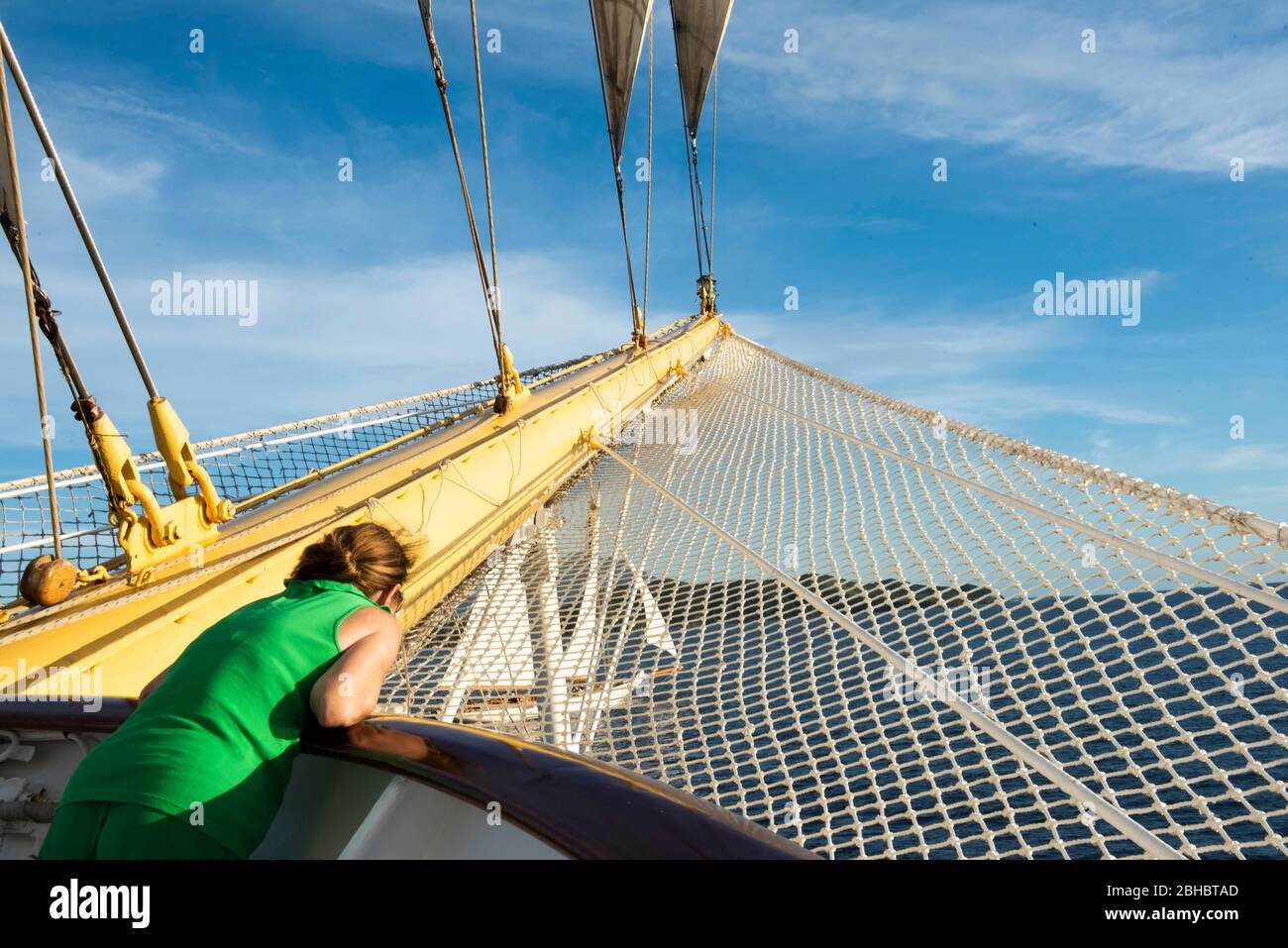 Caribbean, St .Kitts Island, Nevis, sailboat. Woman looking overboard ...