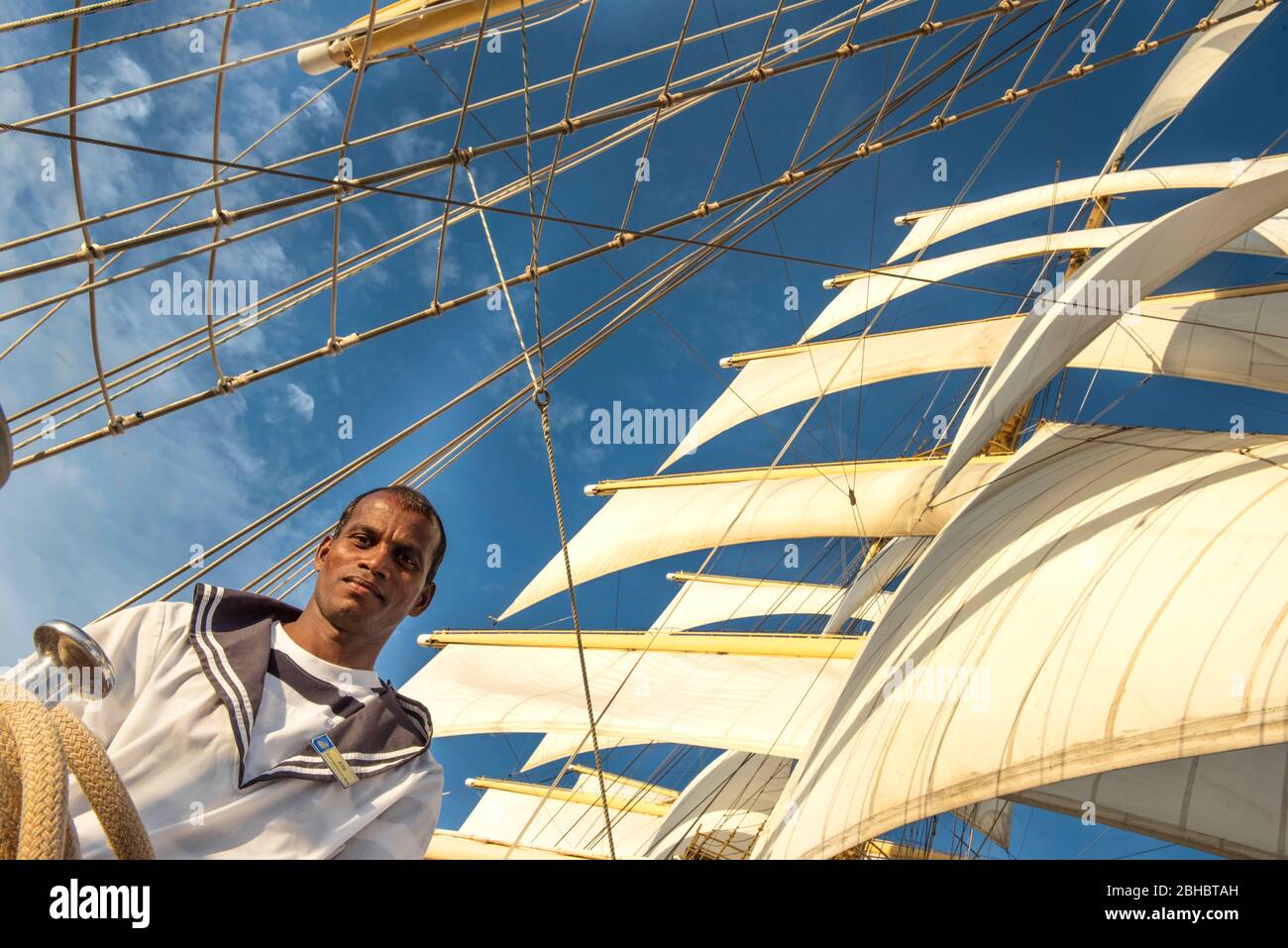Caribbean, St .Kitts, Nevis. Sailor crew on the Star Clipper sailing ...