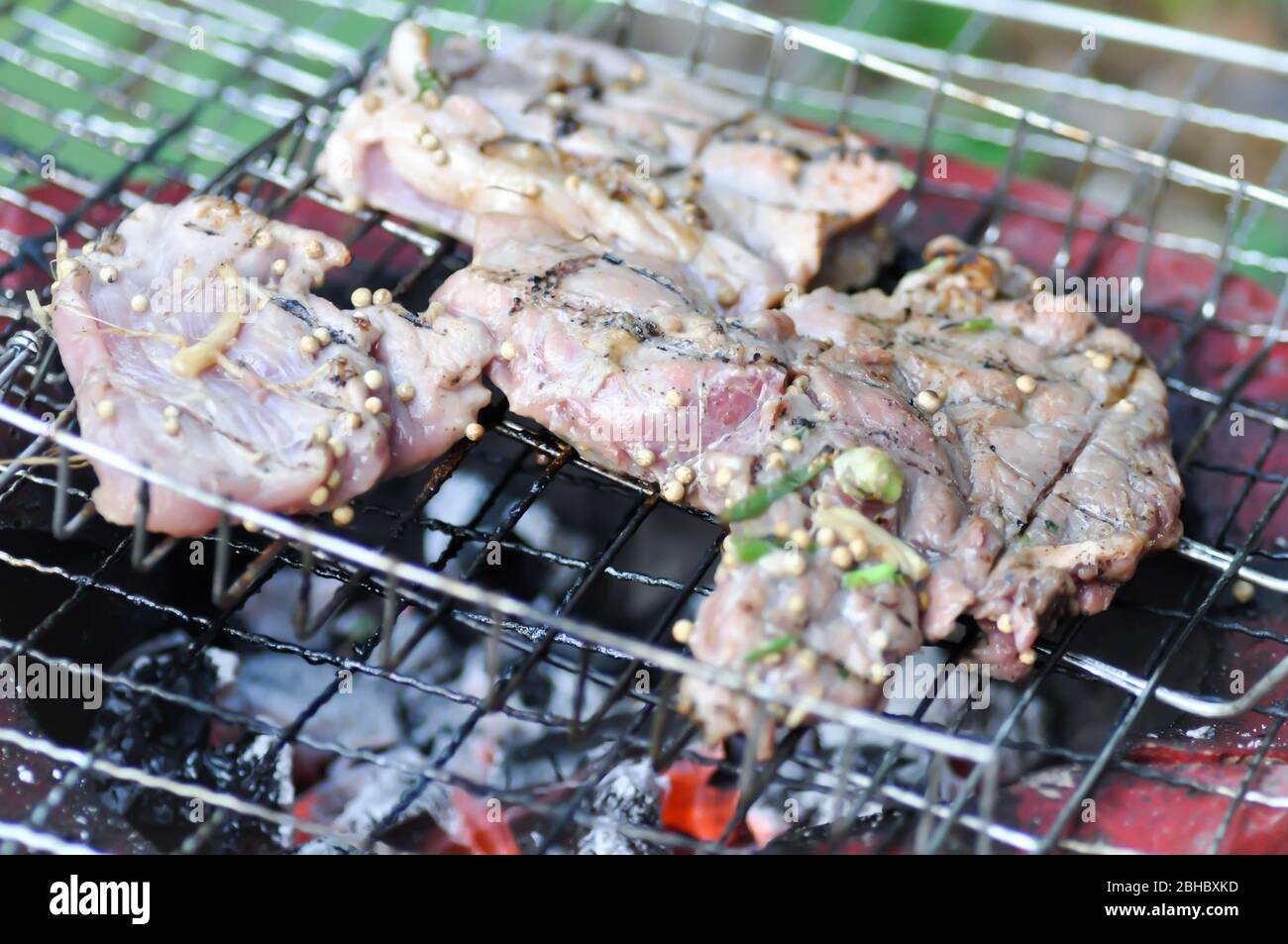 grilled beef and grilled pork on the charcoal brazier stove Stock Photo ...