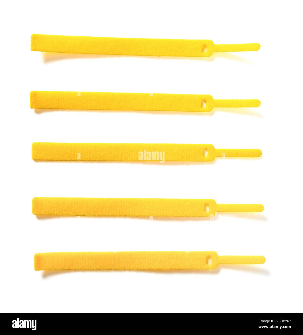 yellow velcro cable ties on white background Stock Photo - Alamy