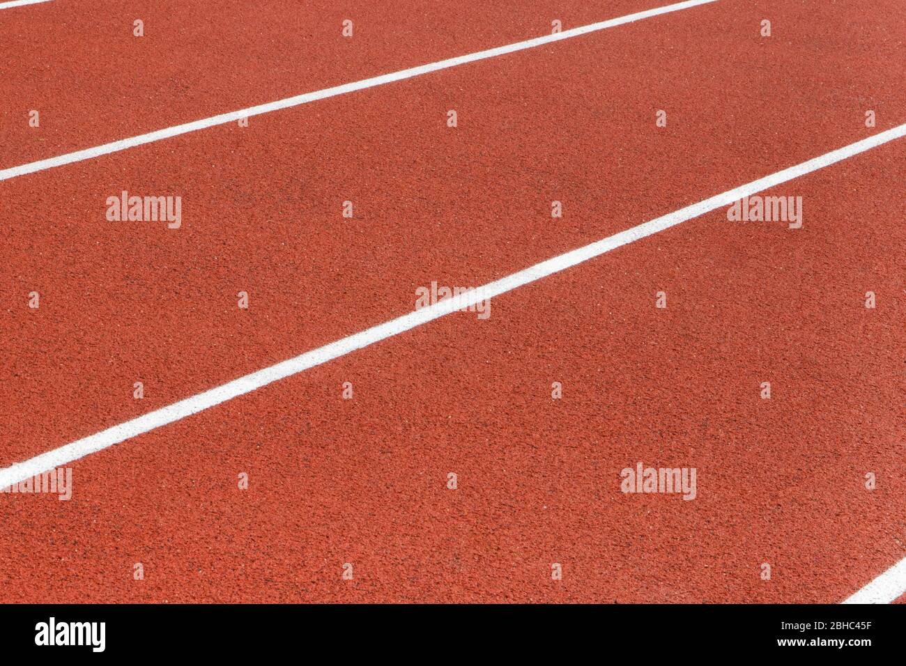 Red treadmill in sport field. Concept of healthy and sporty lifestyles ...