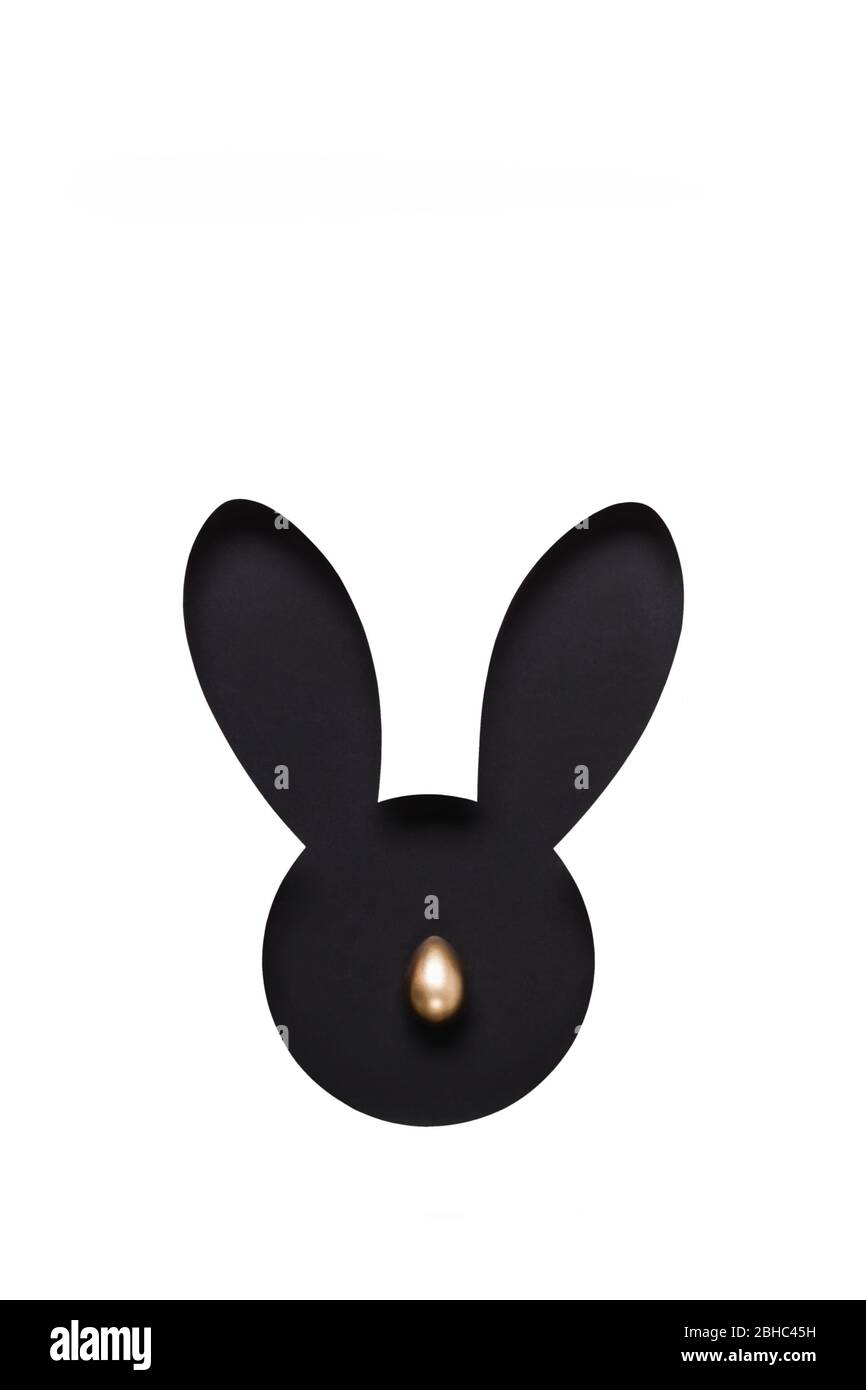 Creative layout made of black Hole rabbit head with golden egg nose ...