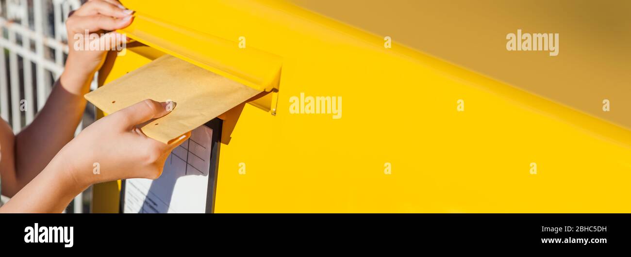 Postbox Envelope Mail Delivery. Inserting Letter In Mailbox Stock Photo ...