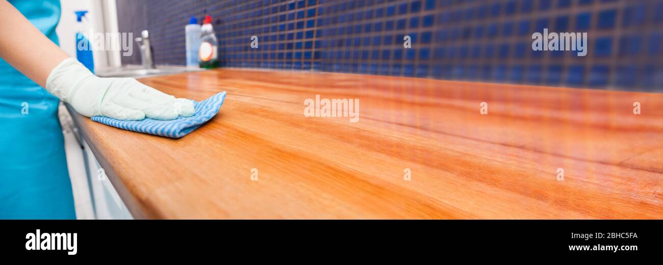 Cleaning Service Kitchen. Woman Wiping Worktop At Home Stock Photo - Alamy