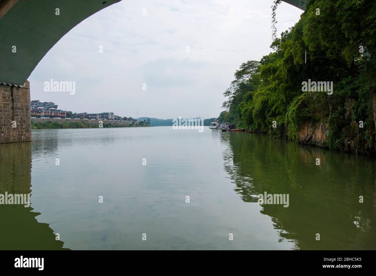 An arch bridge in a river Stock Photo - Alamy