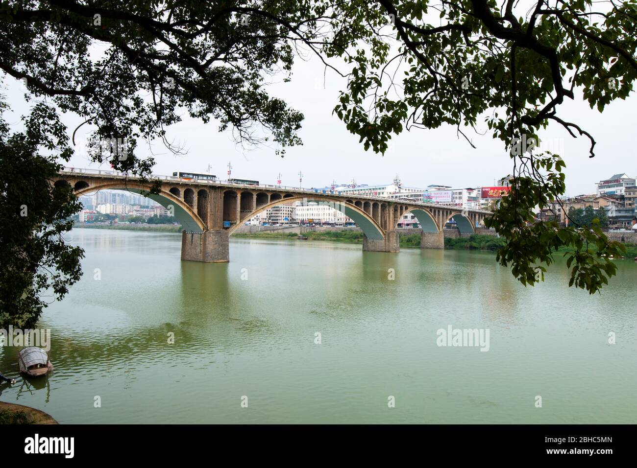 An arch bridge in a river Stock Photo - Alamy