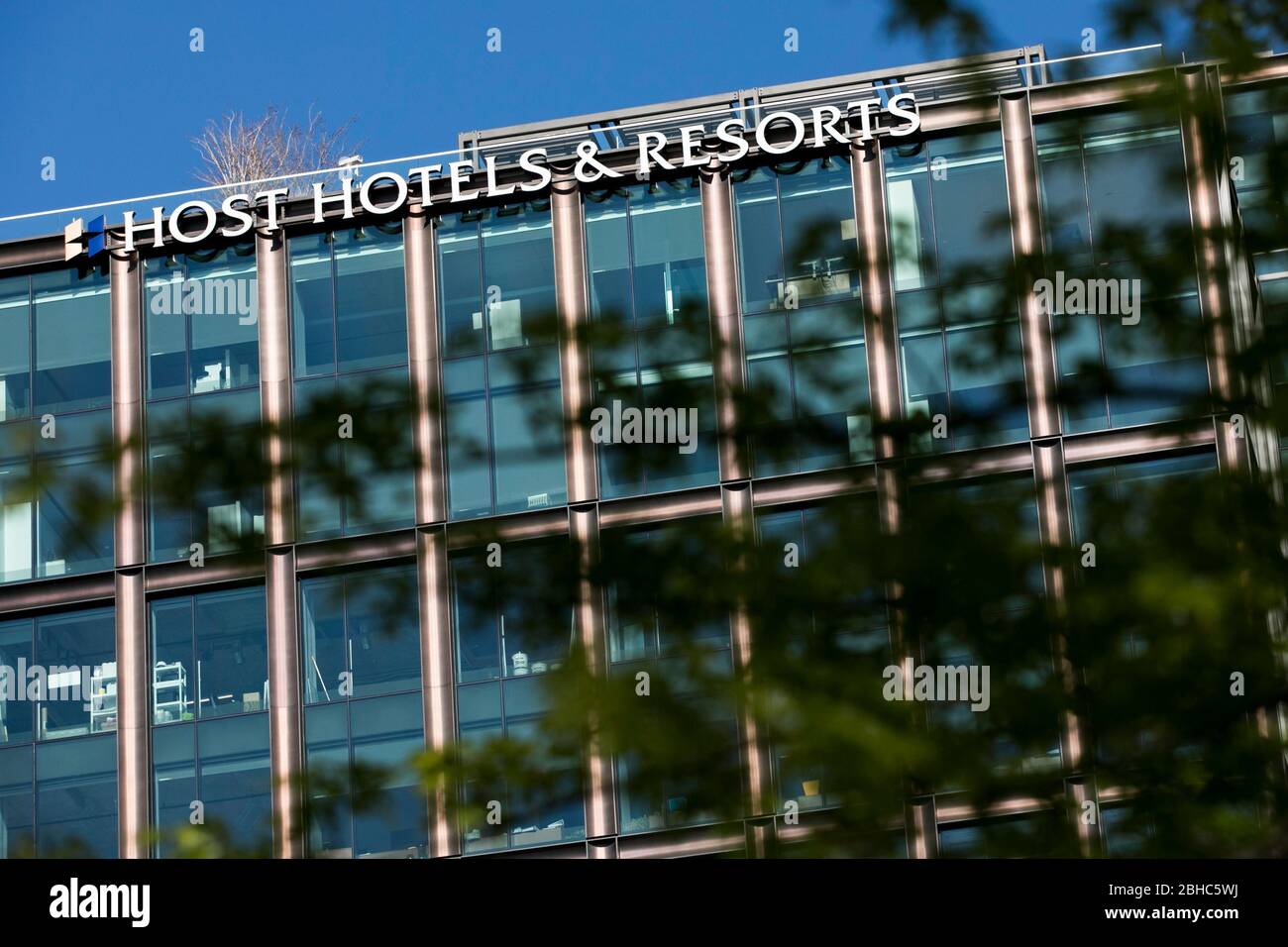A logo sign outside of the headquarters of Host Hotels & Resorts in ...