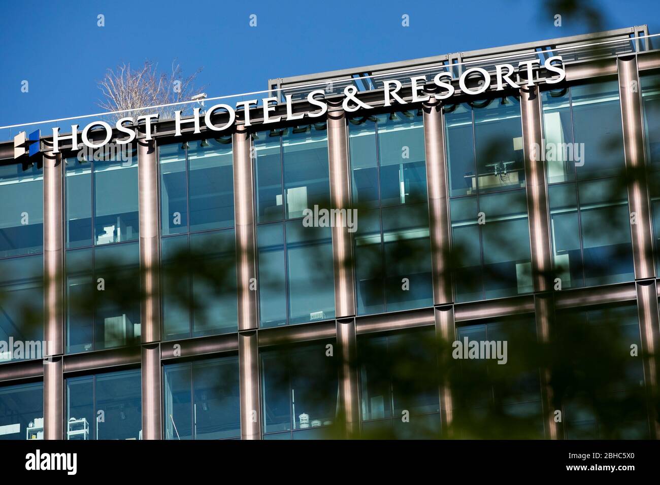 A logo sign outside of the headquarters of Host Hotels & Resorts in ...