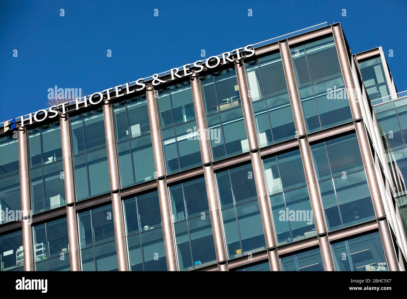 A logo sign outside of the headquarters of Host Hotels & Resorts in ...