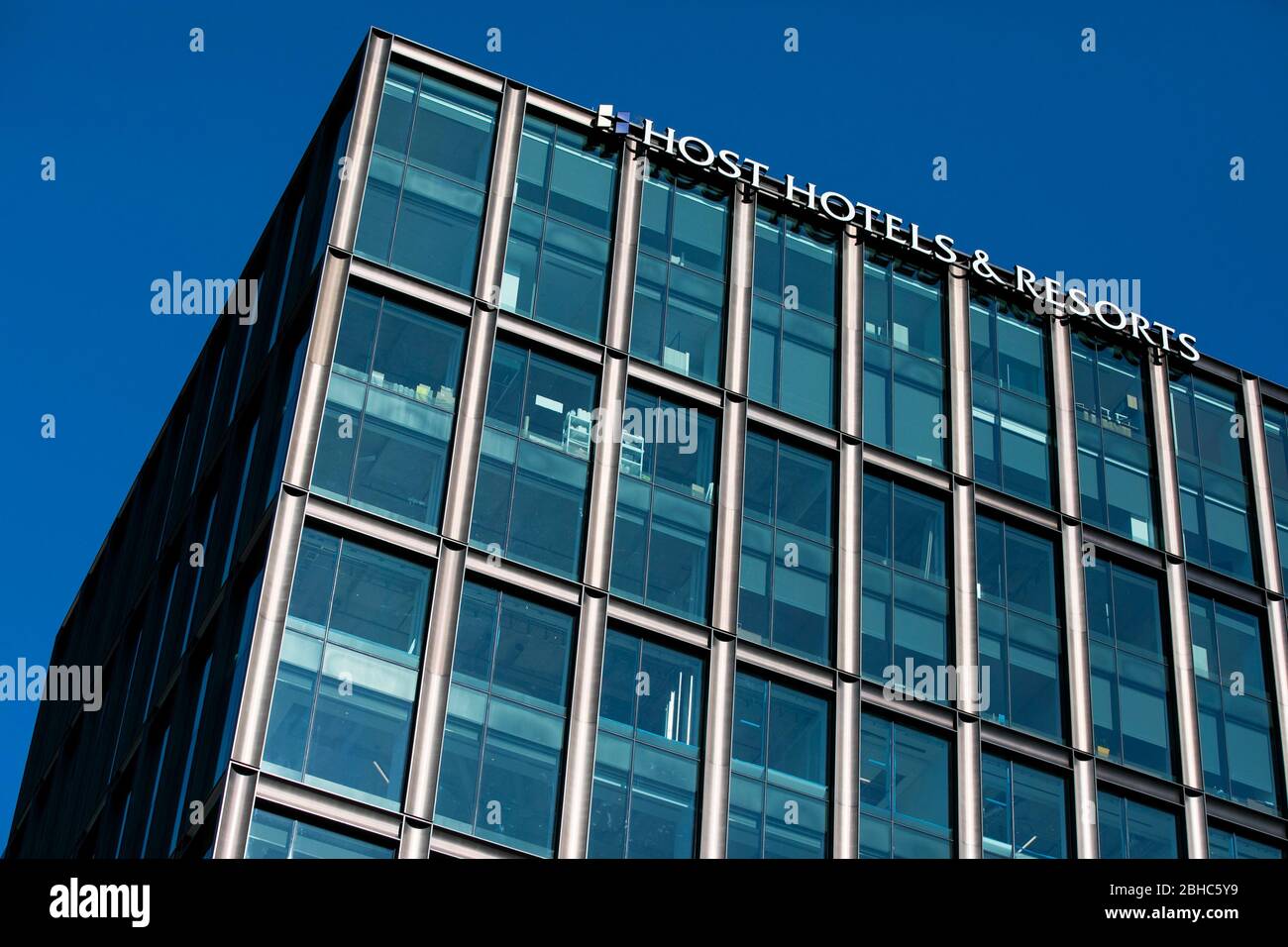 A logo sign outside of the headquarters of Host Hotels & Resorts in ...