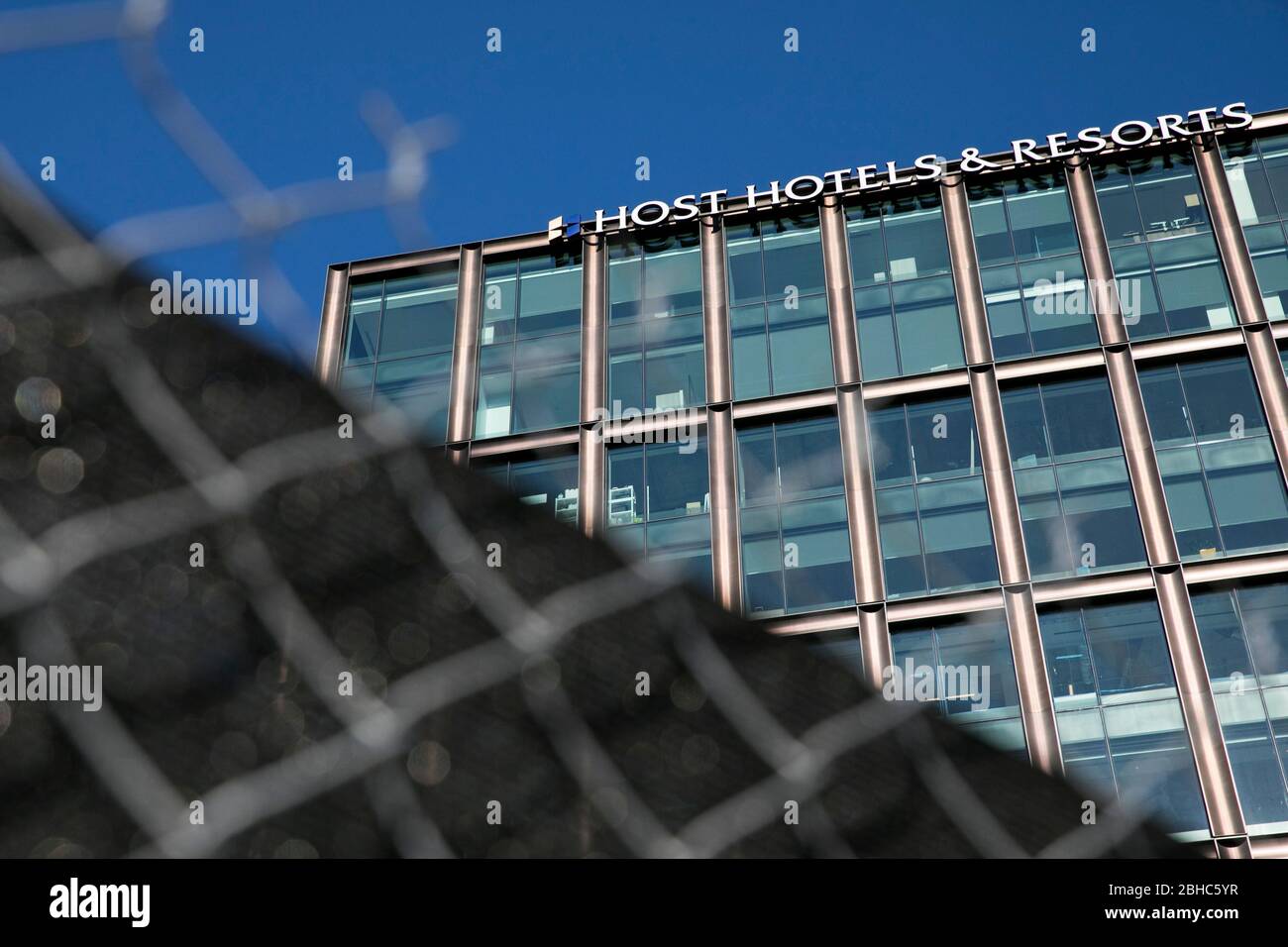 A logo sign outside of the headquarters of Host Hotels & Resorts in ...