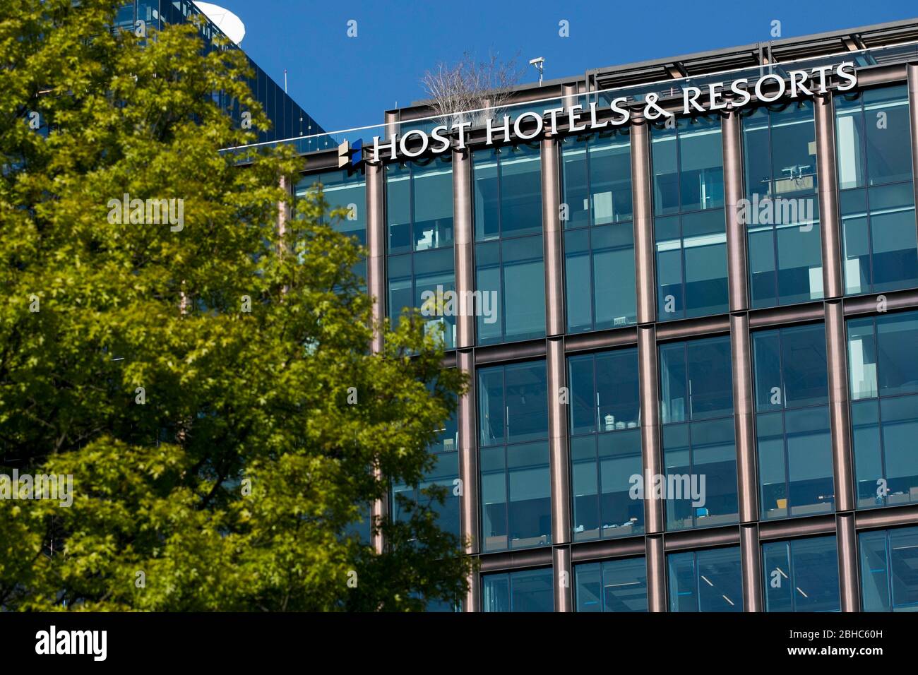 A logo sign outside of the headquarters of Host Hotels & Resorts in ...