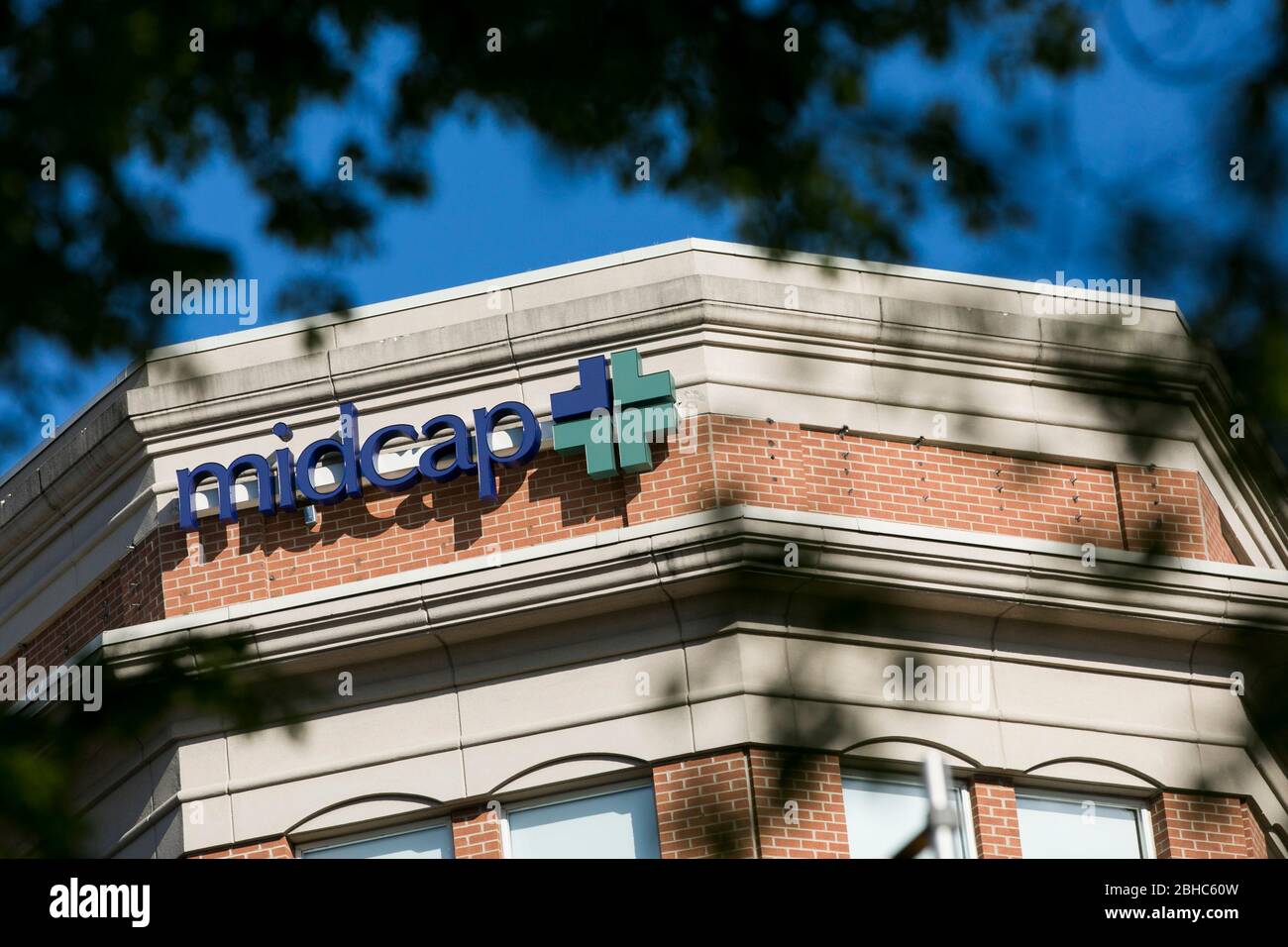 A logo sign outside of the headquarters of MidCap Financial Services in ...