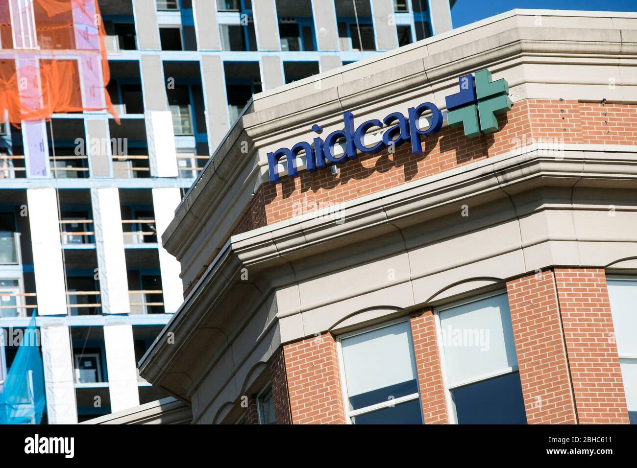 A logo sign outside of the headquarters of MidCap Financial Services in ...