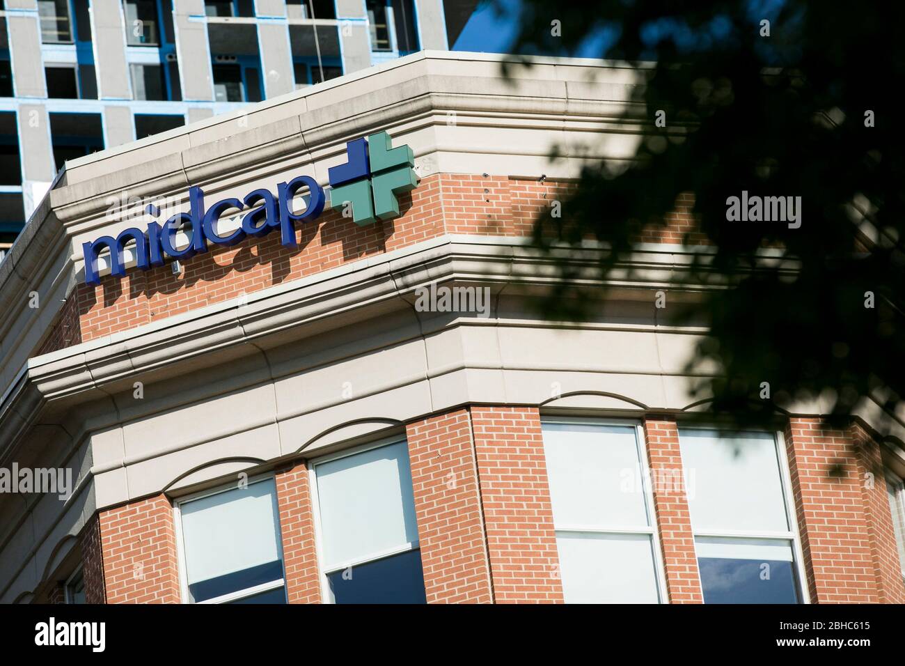 A logo sign outside of the headquarters of MidCap Financial Services in ...