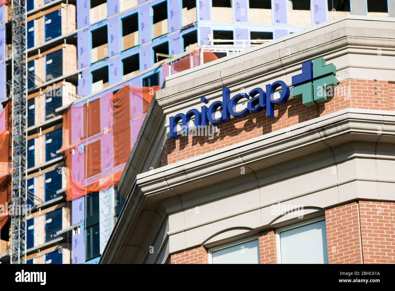 A logo sign outside of the headquarters of MidCap Financial Services in ...