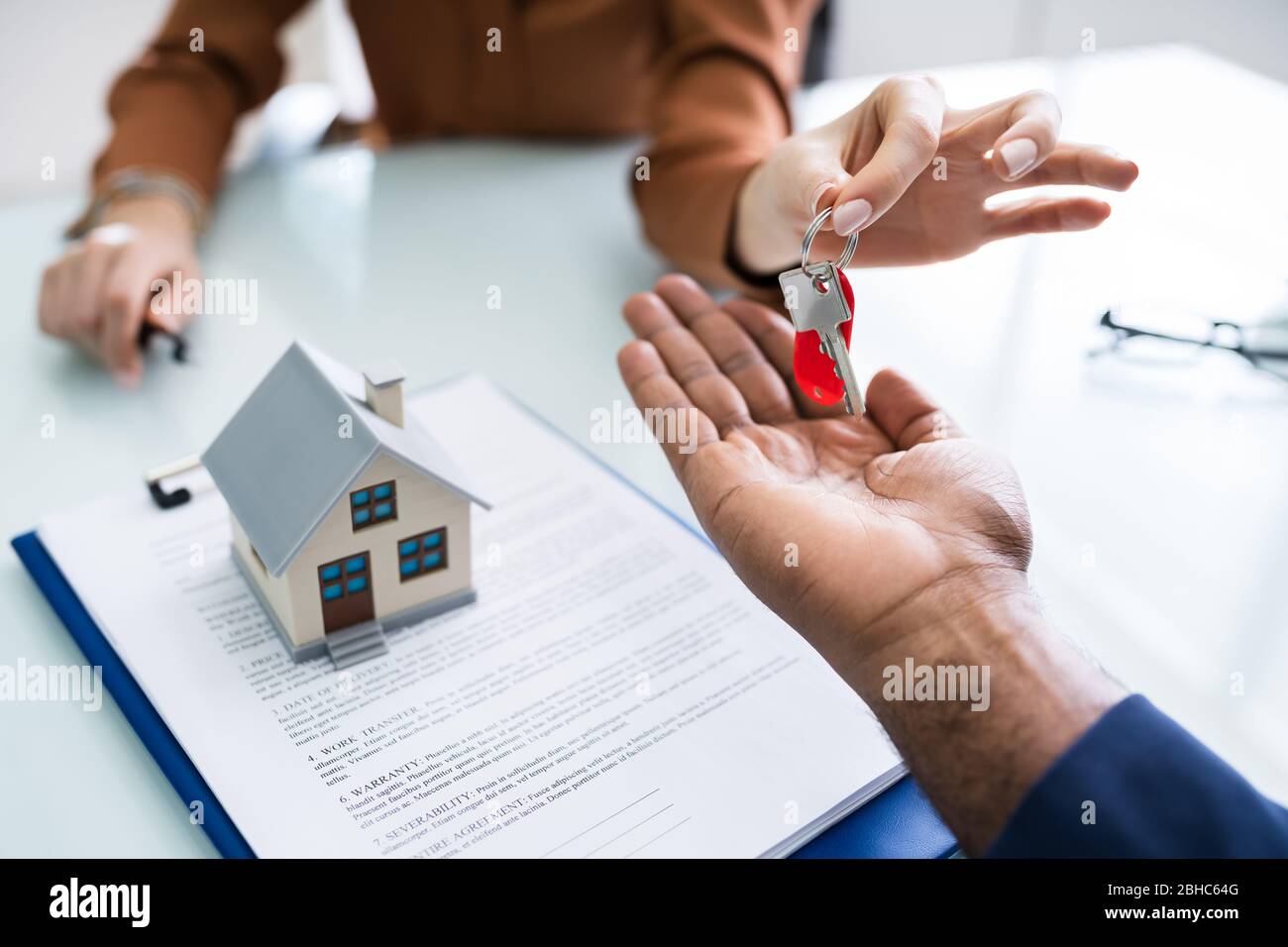 Realtor Giving House Keys To Client After Signing Contract Stock Photo ...