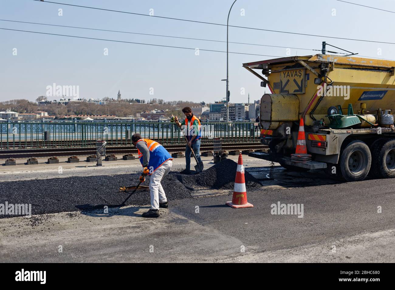 Builders wearing black face mask for protection from coronavirus spread ...