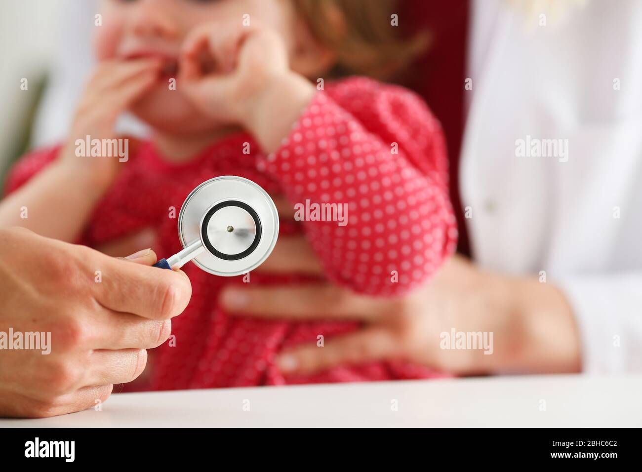 Little scared child at doctor reception Stock Photo - Alamy