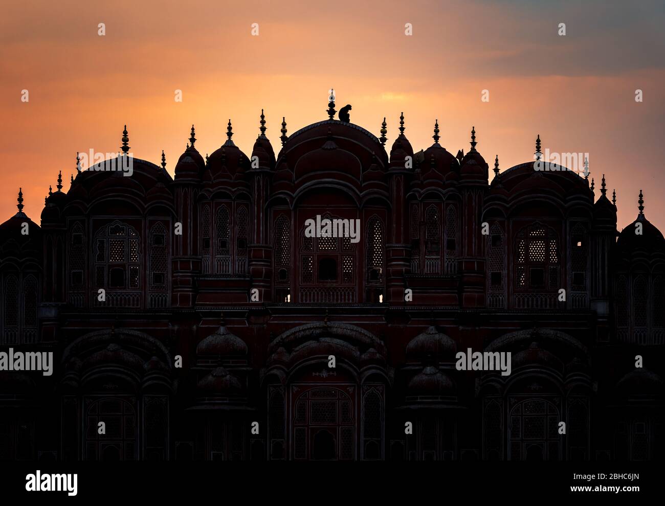 Silhouette of Hawa Mahal palace with monkey at sunset, Jaipur ...