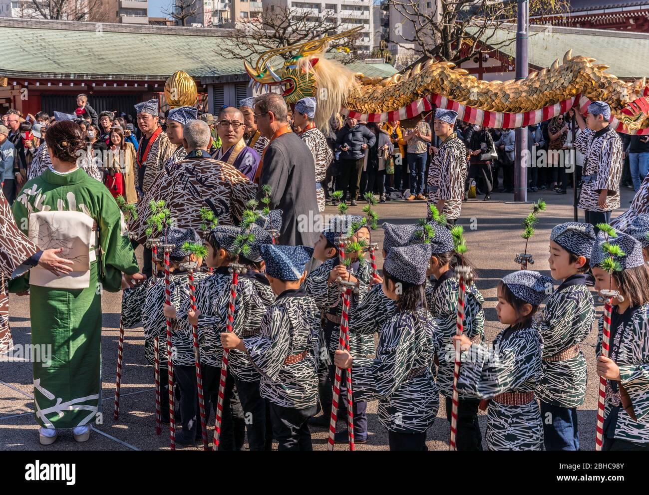 tokyo, japan - march 18 2020: Japanese children walking in row holding ...