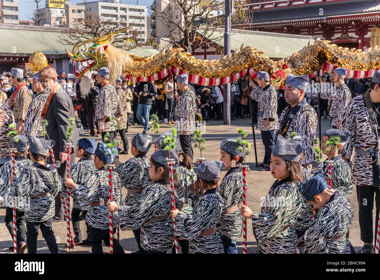 tokyo, japan - march 18 2020: Japanese children walking in row holding ...