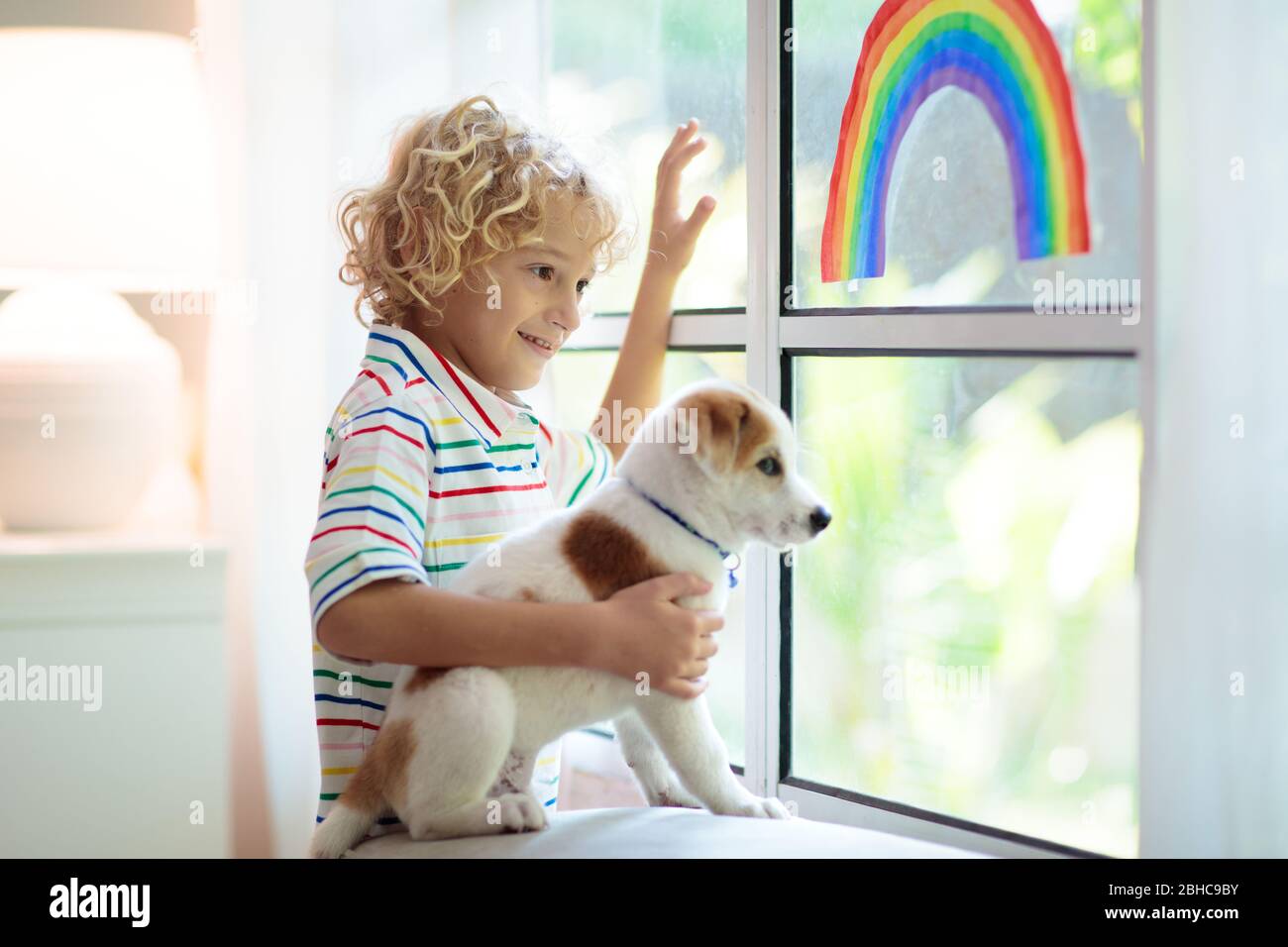 Coronavirus quarantine. Stay home. Kids sitting at window. Children ...