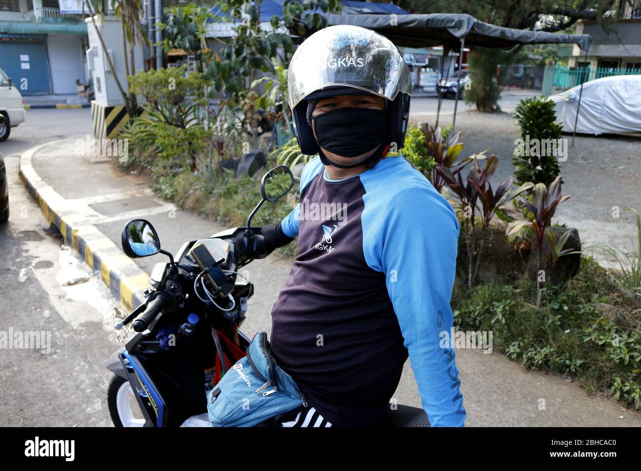 Antipolo City, Philippines - April 22, 2020: Motorcycle taxi driver ...