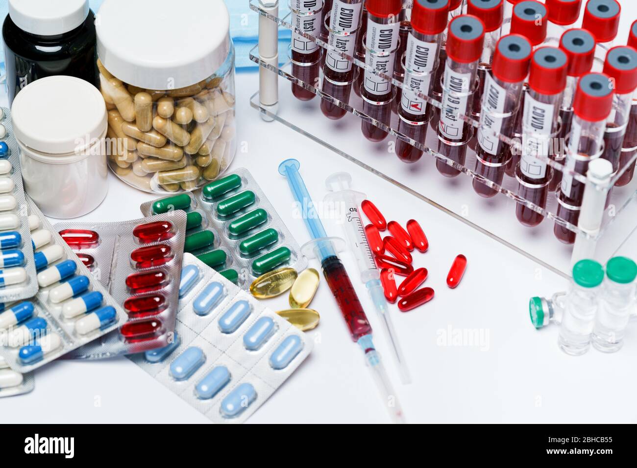 packings of pills and capsules of medicines and blood test tubes Stock ...
