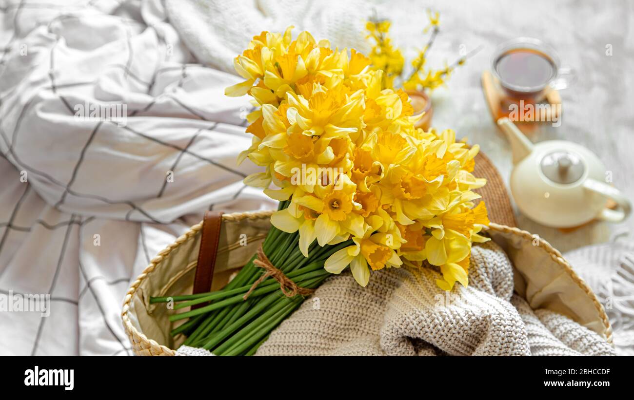Spring still life with a Cup of tea and flowers Stock Photo - Alamy