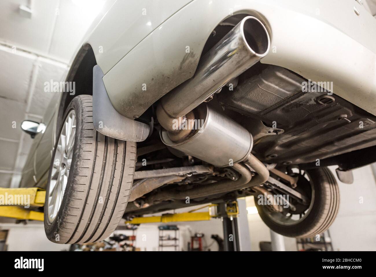 Close up of car exhaust system pipe at the garage, automotive car ...