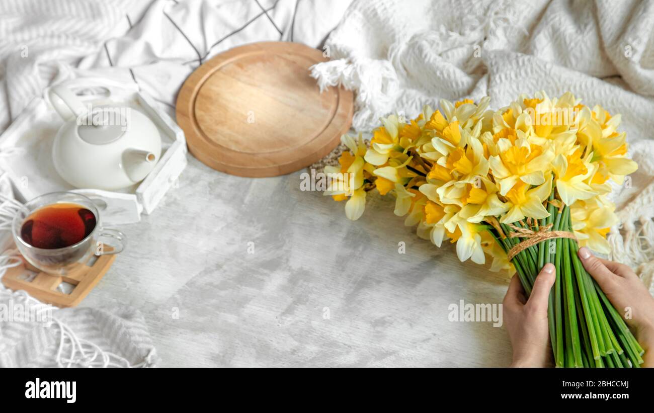 Spring still life with a Cup of tea and flowers Stock Photo - Alamy