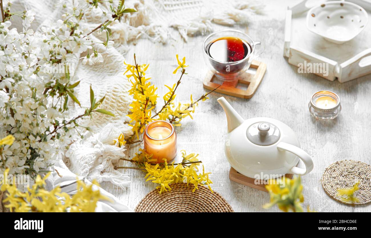 Spring still life with a Cup of tea and flowers Stock Photo - Alamy