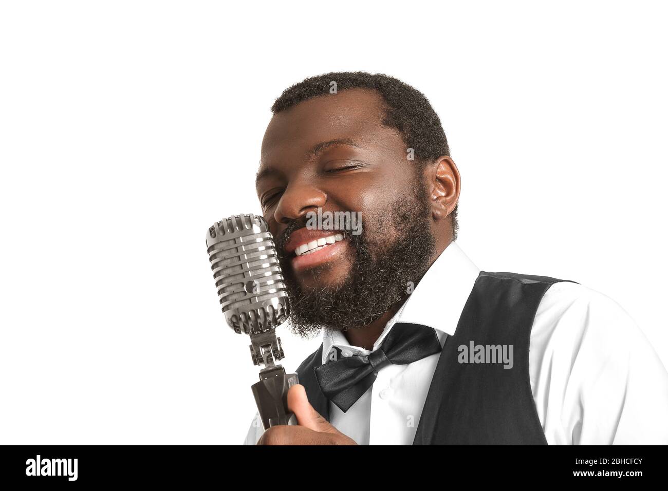Male African-American singer on white background Stock Photo - Alamy