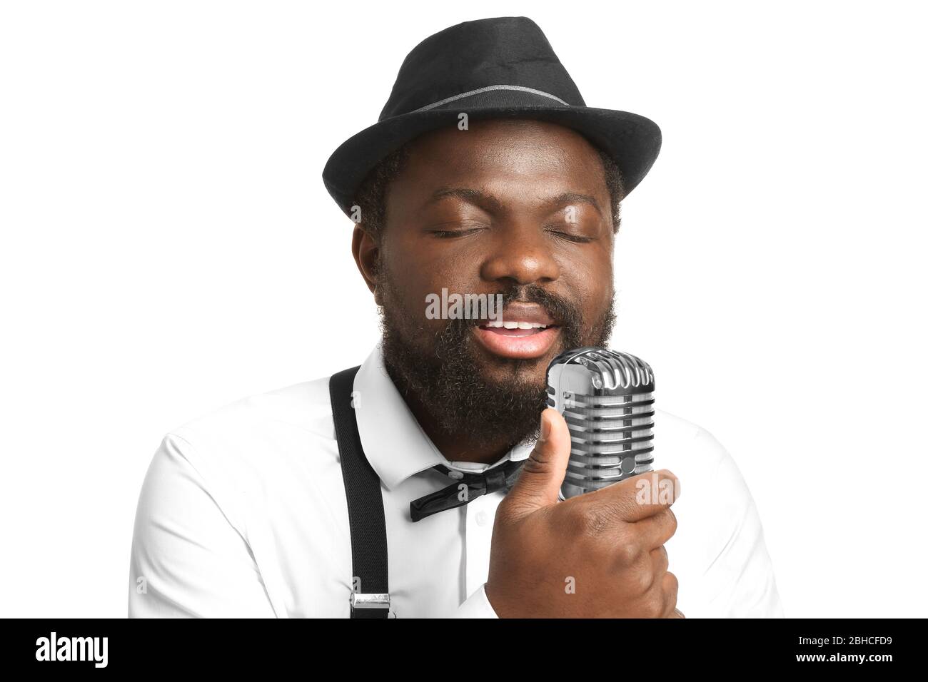 Male African-American singer on white background Stock Photo - Alamy