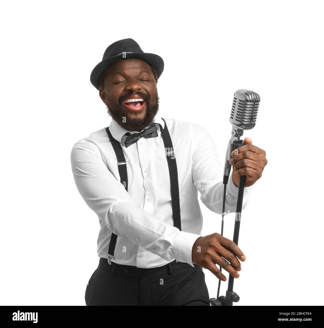 Male African-American singer on white background Stock Photo - Alamy