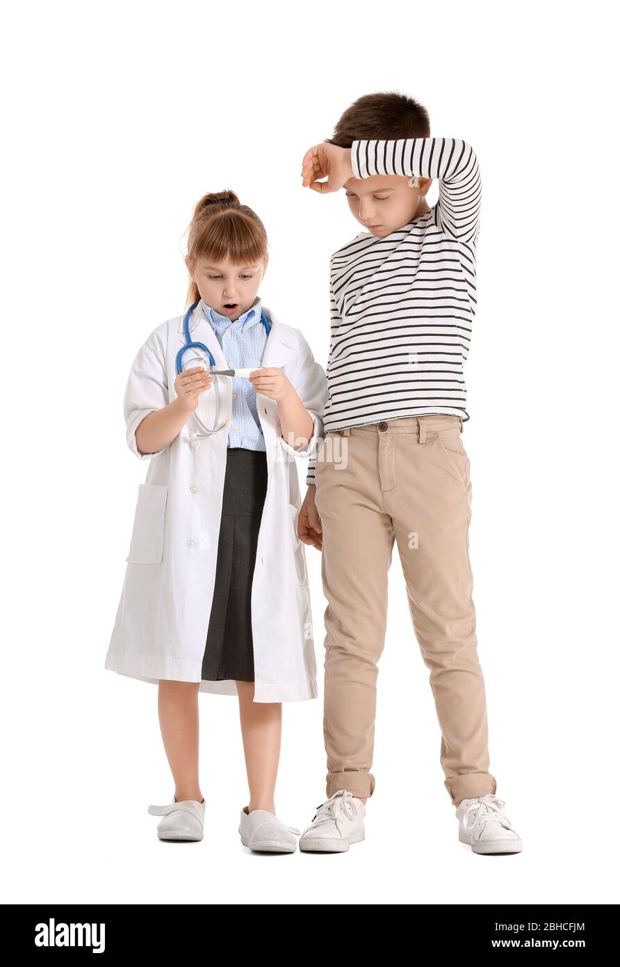 Cute little doctor with patient on white background Stock Photo - Alamy