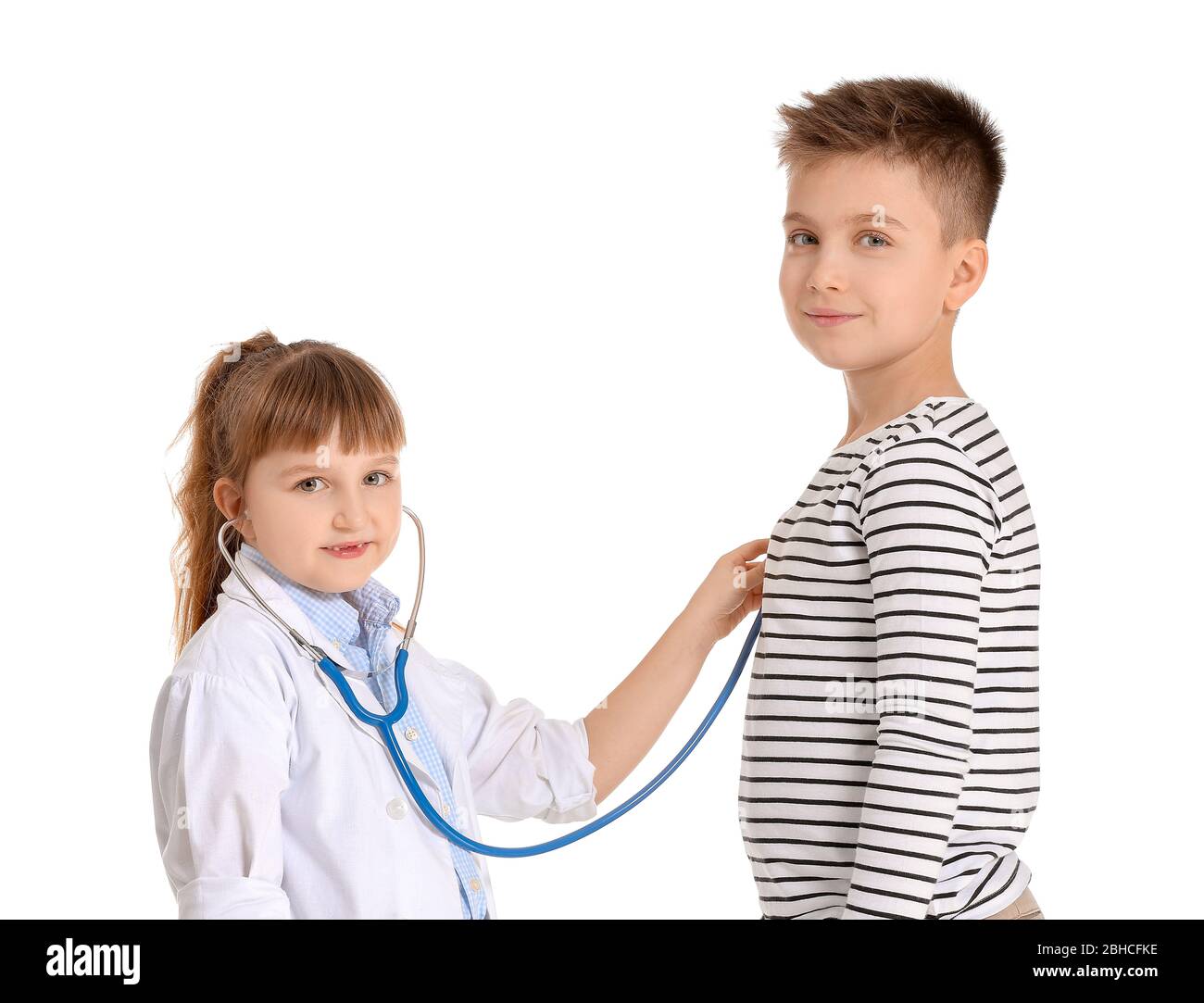 Cute little doctor with patient on white background Stock Photo - Alamy
