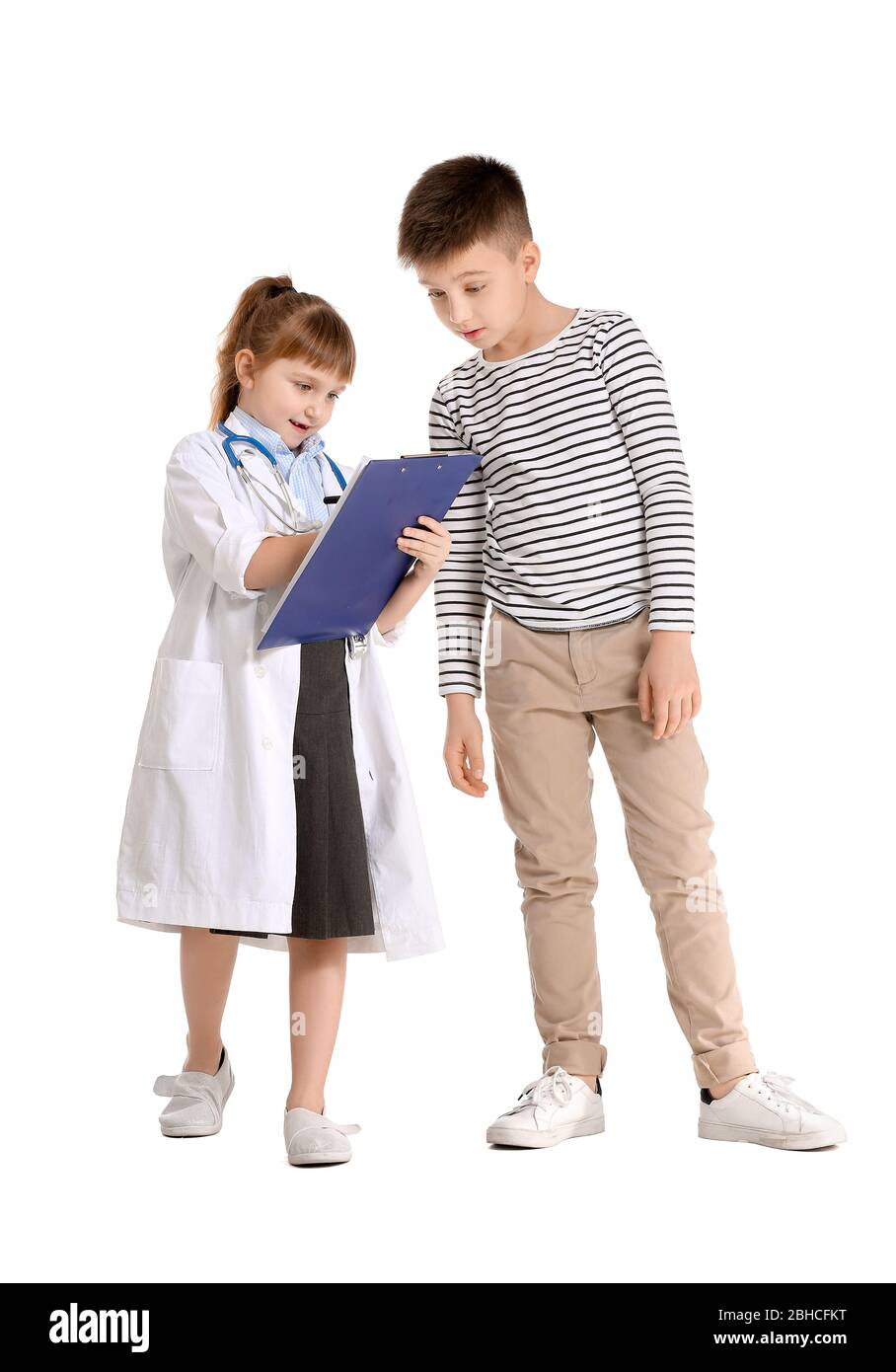 Cute little doctor with patient on white background Stock Photo - Alamy